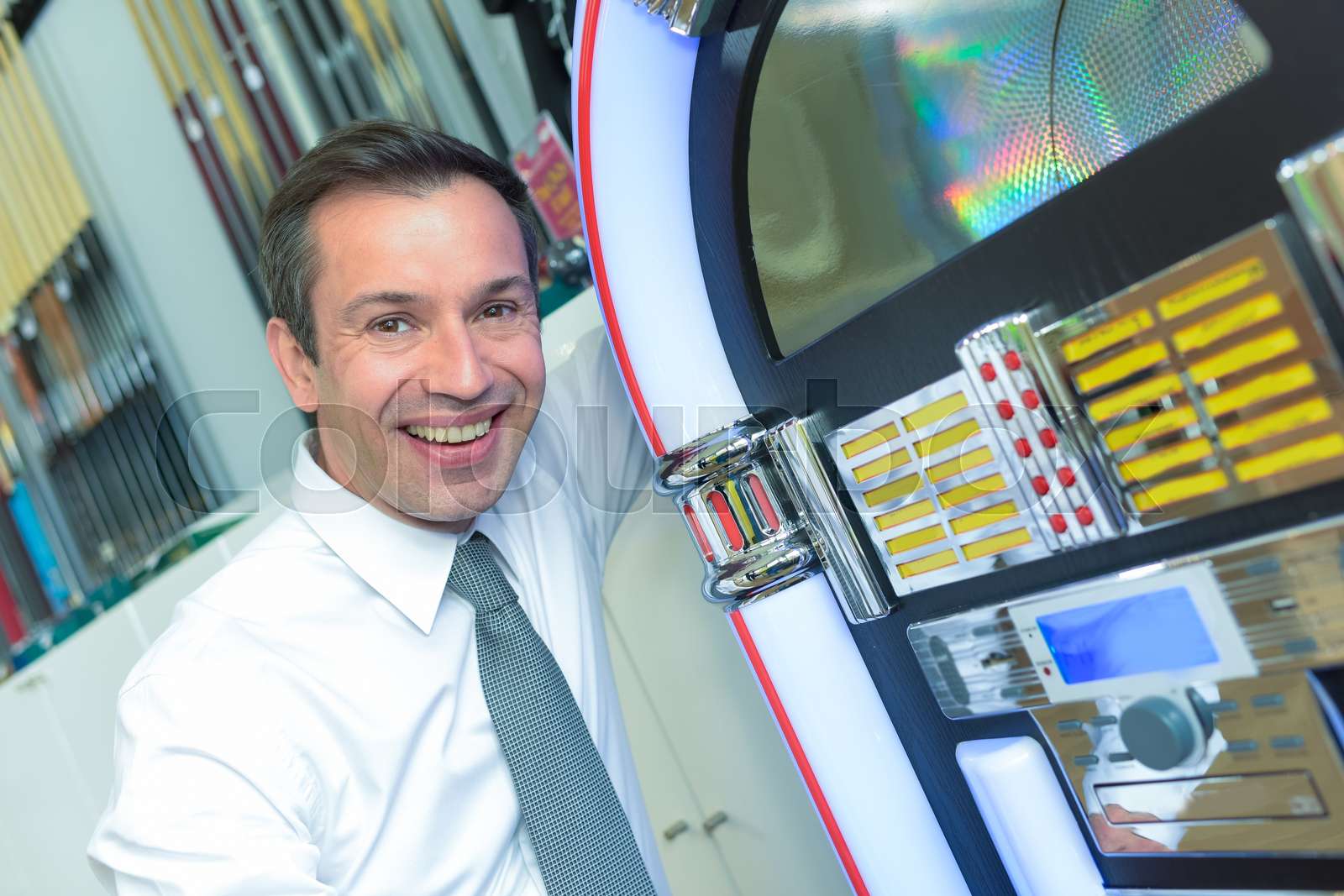man next to juke box | Stock image | Colourbox