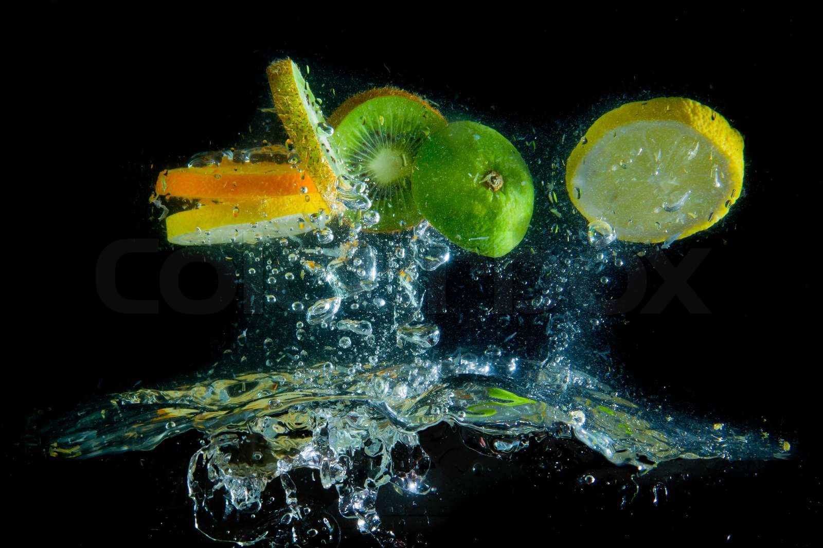 fruit splashing in the water | Stock image | Colourbox