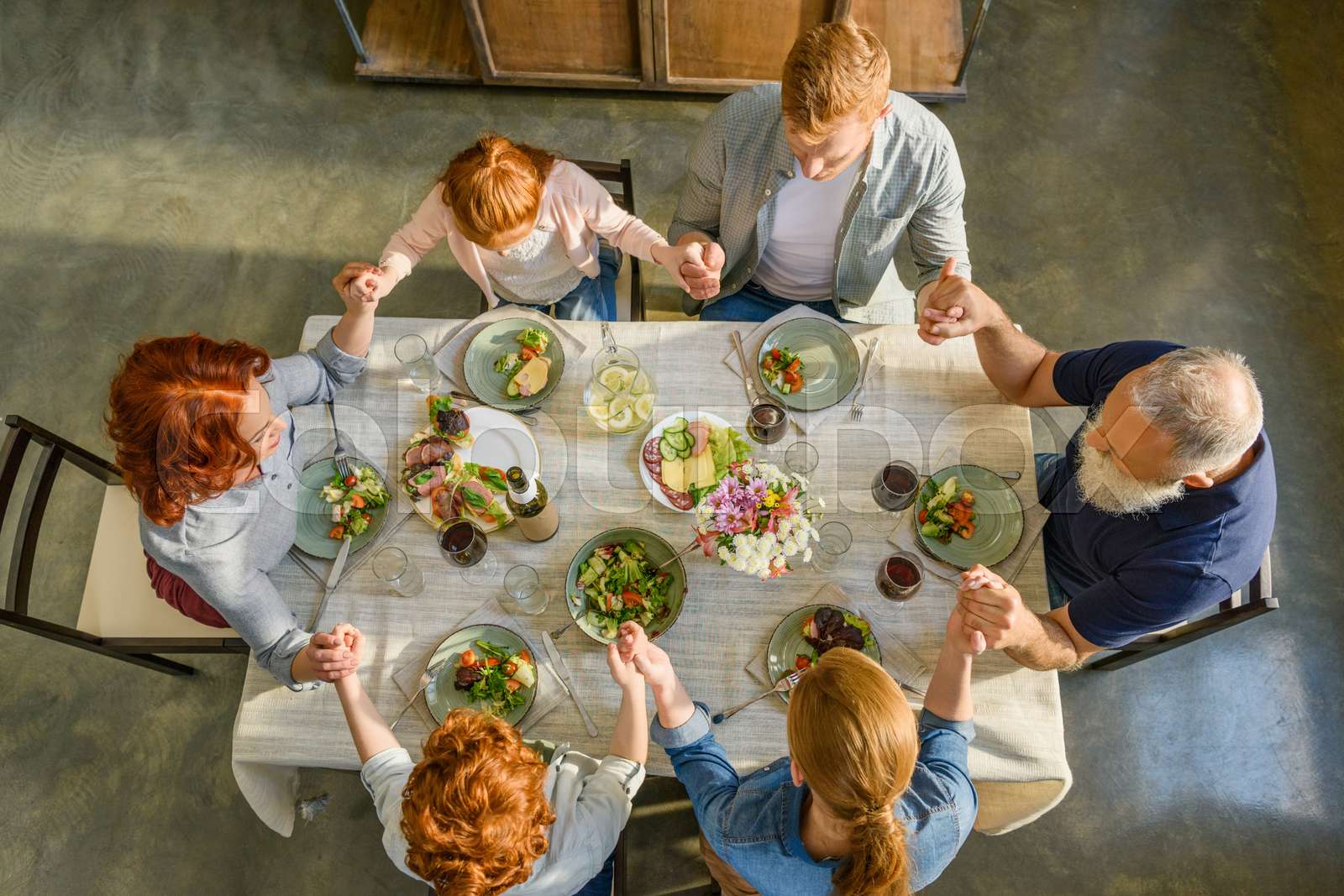 family praying during dinner | Stock image | Colourbox