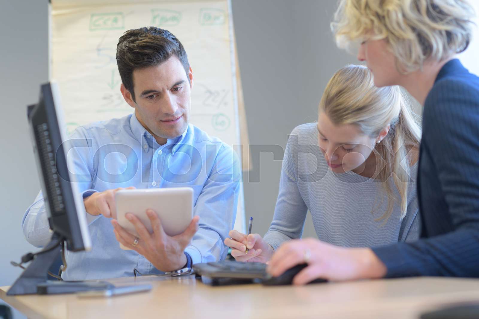 team setting up a meeting | Stock image | Colourbox