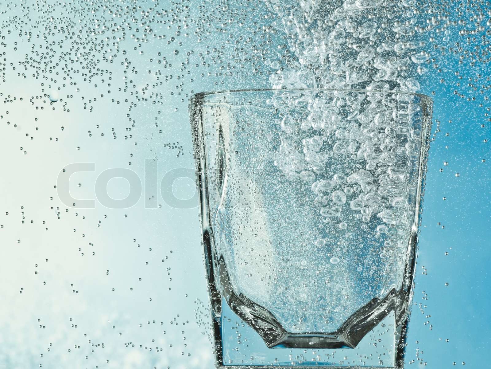 glass being filled with mineral water | Stock image | Colourbox