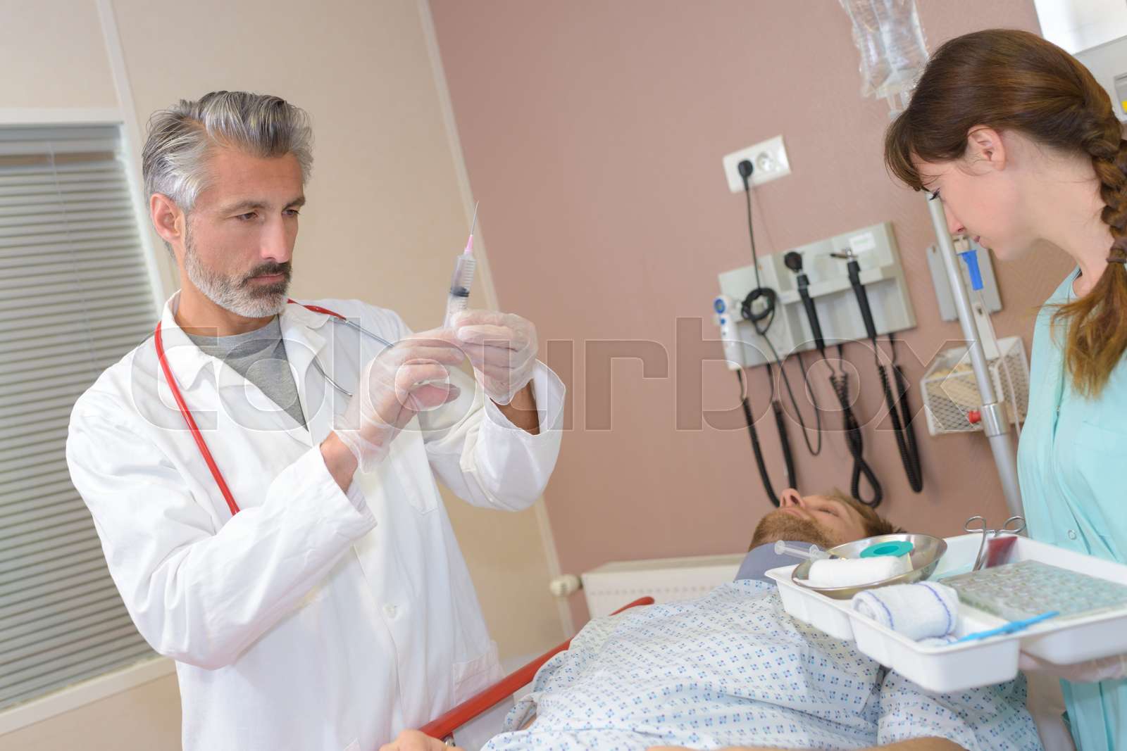 doctor raedy ti give injured man tetanus toxoid injection | Stock image ...