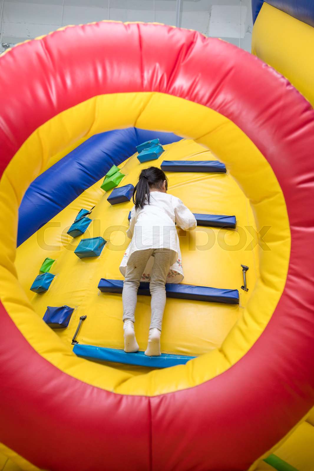 Asian Little Chinese Girl climbing up ramp | Stock image | Colourbox
