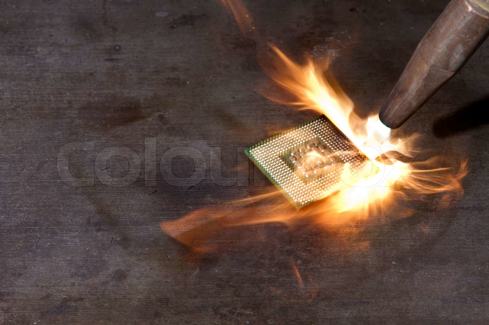 CPU and welding torch with big flame on metallic ground | Stock image ...