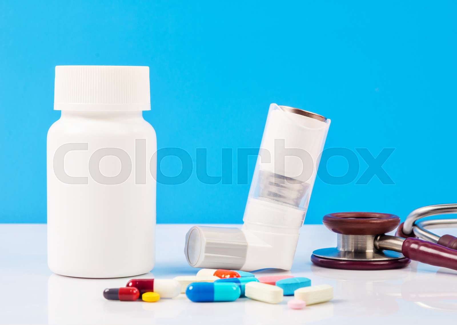 Asthma inhaler with pills. | Stock image | Colourbox
