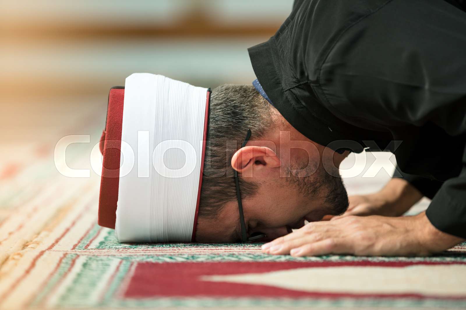 Young Imam praying inside of beautiful mosque | Stock image | Colourbox