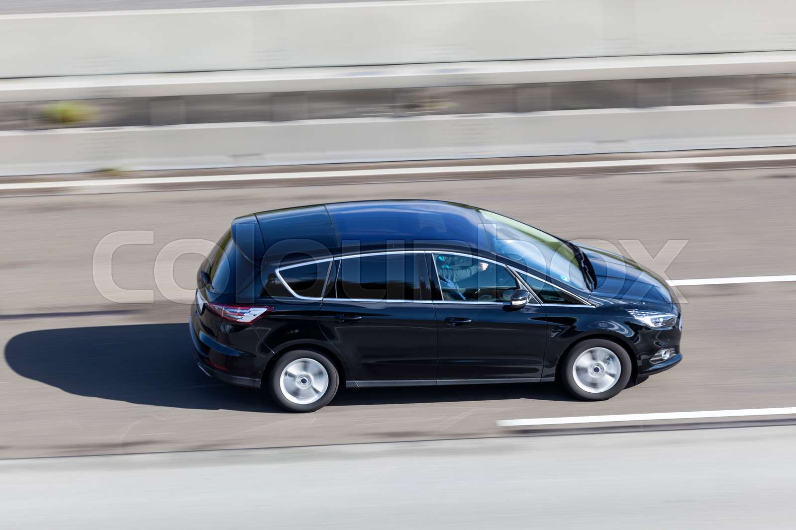 Black van on the road | Stock image | Colourbox