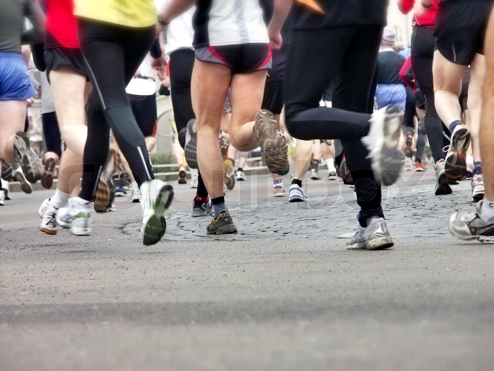Long distance runners in closeup, shallow focus | Stock image | Colourbox