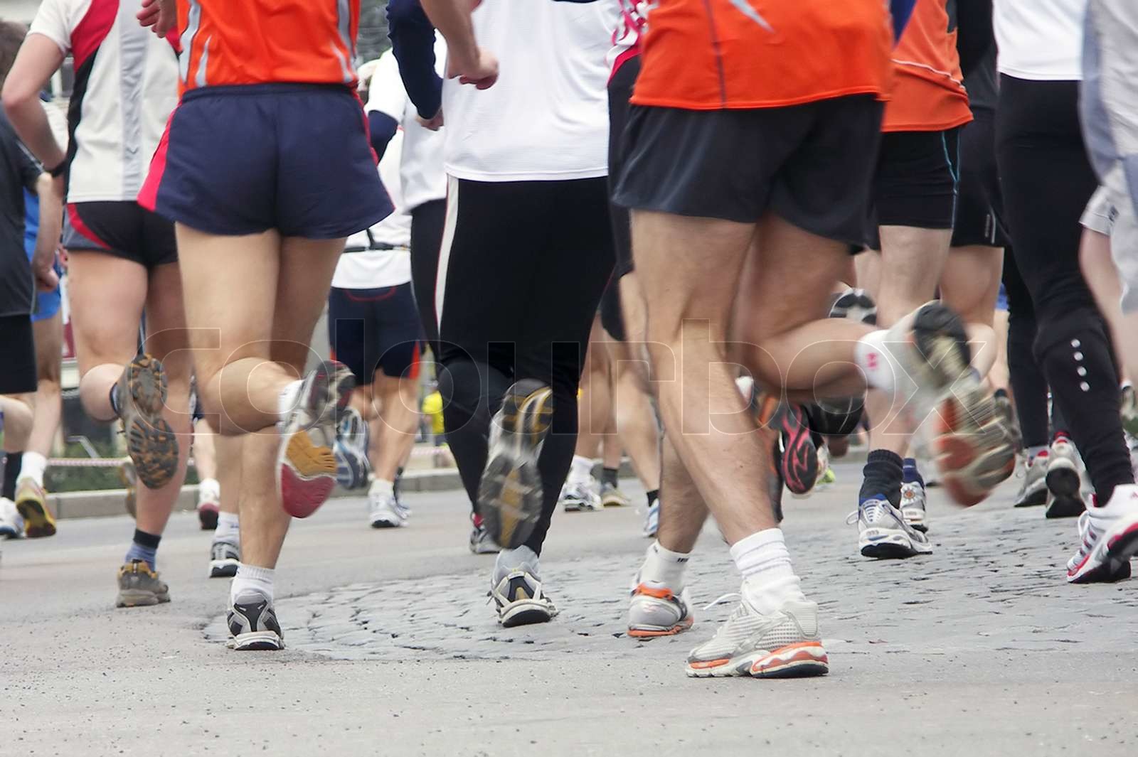 Long distance runners in closeup, shallow focus | Stock image | Colourbox