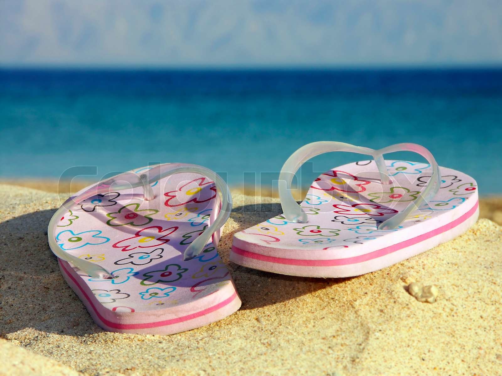Holiday at the seaside - flip-flops on beach | Stock image | Colourbox
