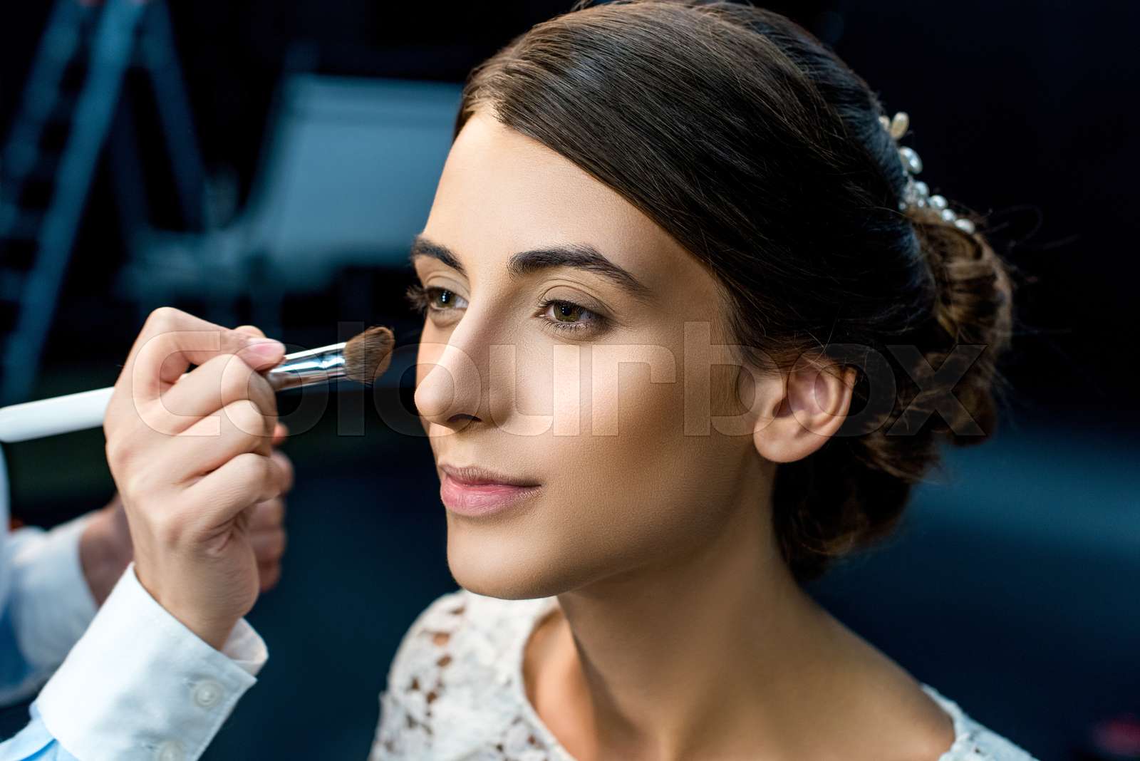 woman getting makeup done | Stock image | Colourbox
