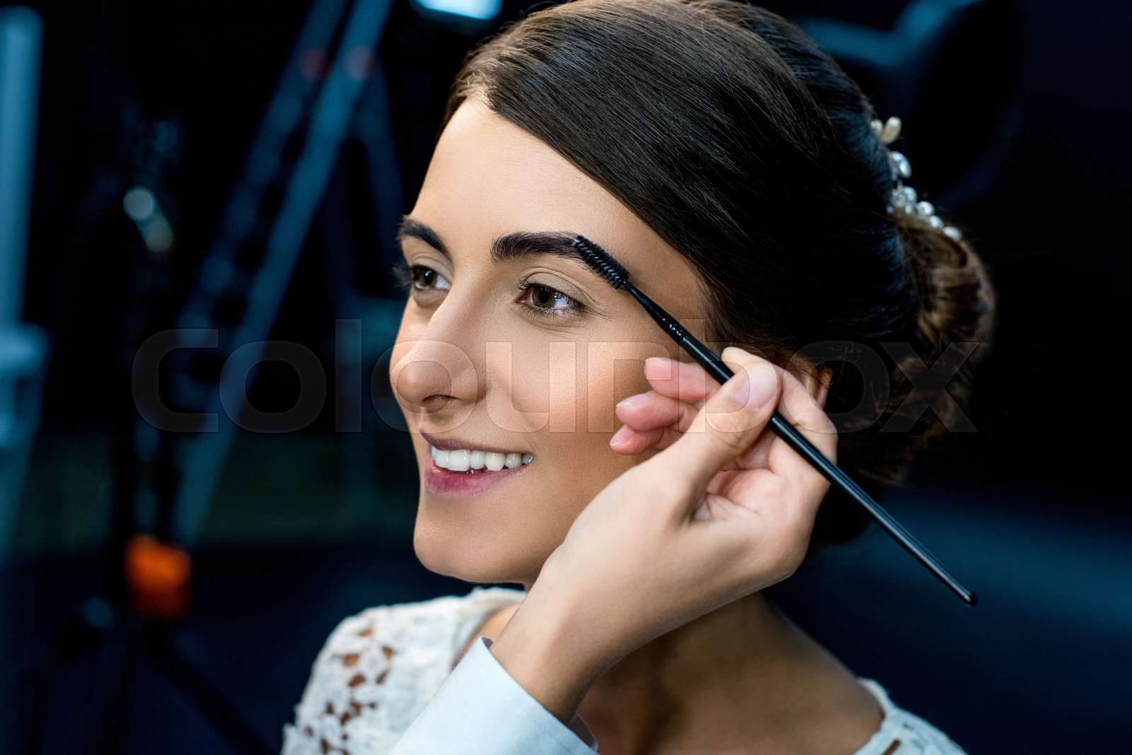woman getting makeup done | Stock image | Colourbox