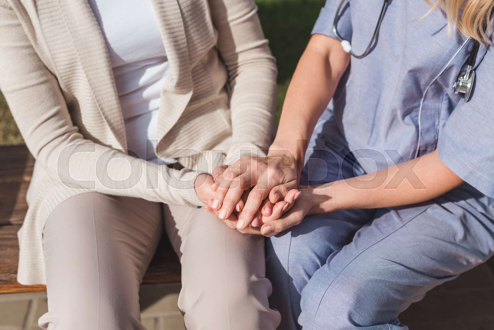 nurse and patient holding hands | Stock image | Colourbox