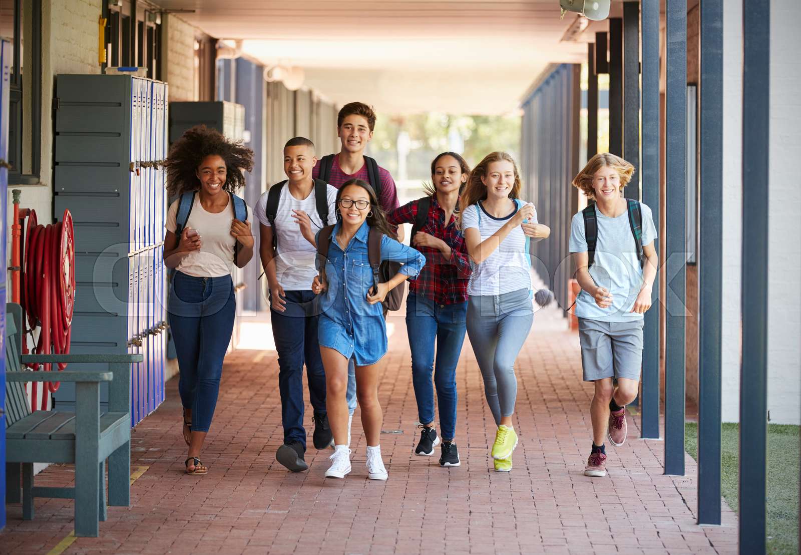 Teenager school kids running in high school hallway | Stock image ...