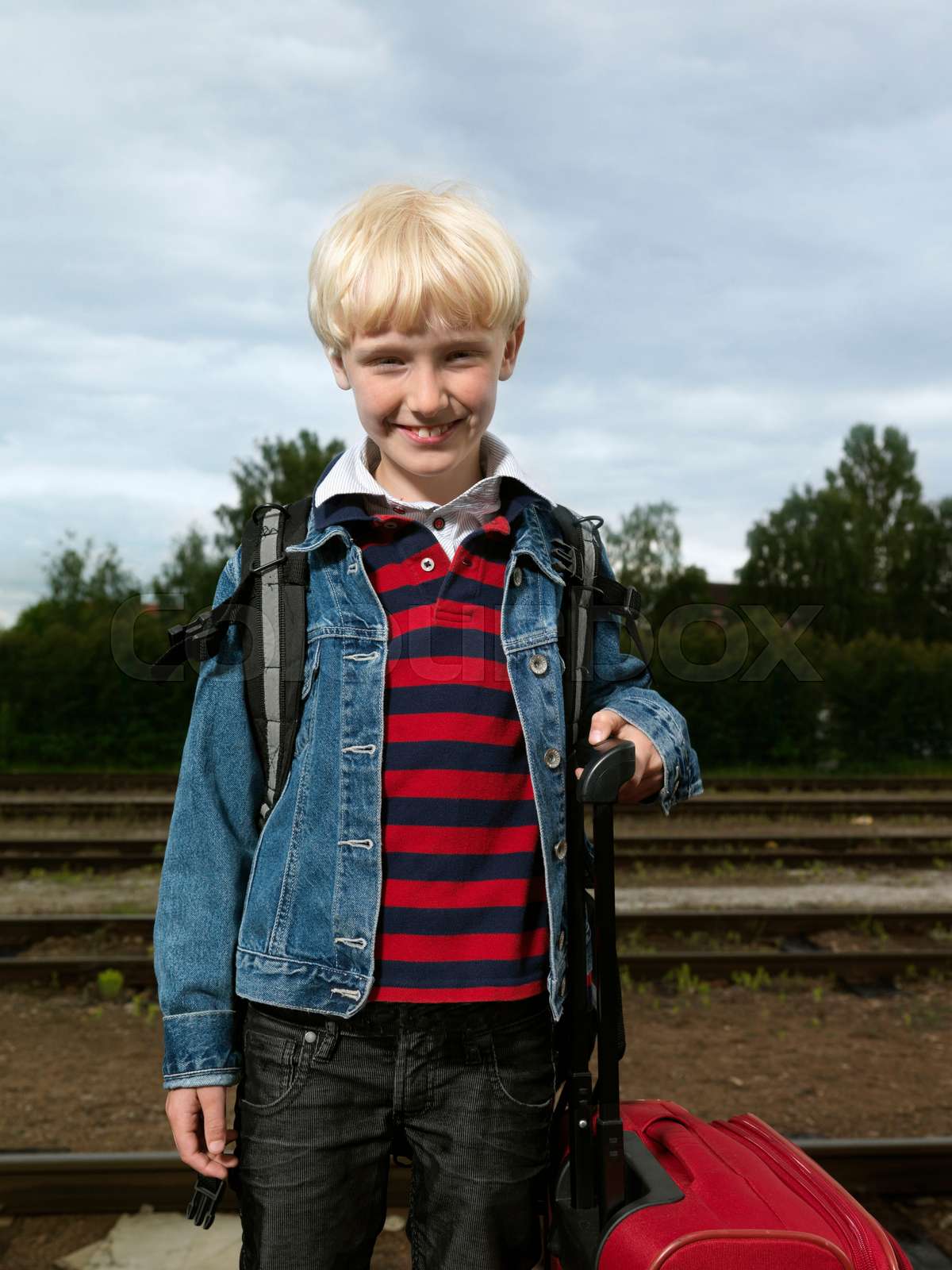 Boy on train station | Stock image | Colourbox