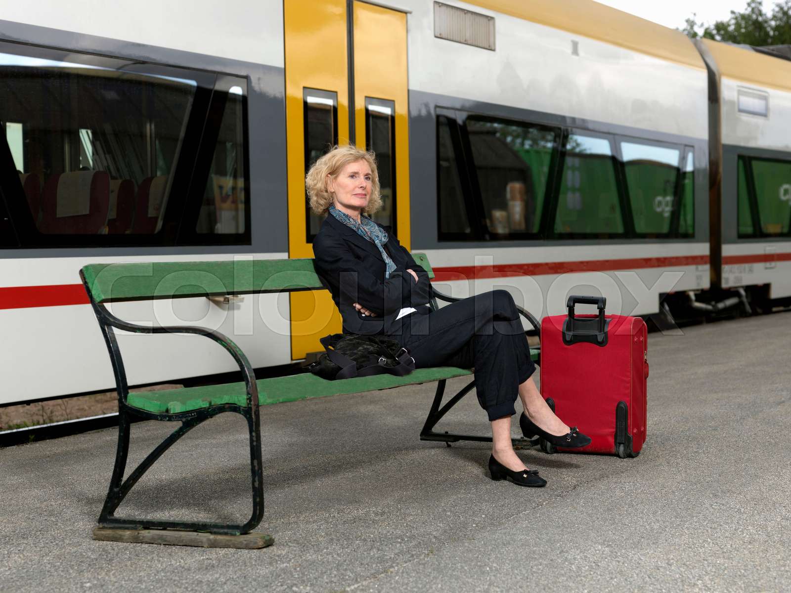 Mature woman on train station | Stock image | Colourbox