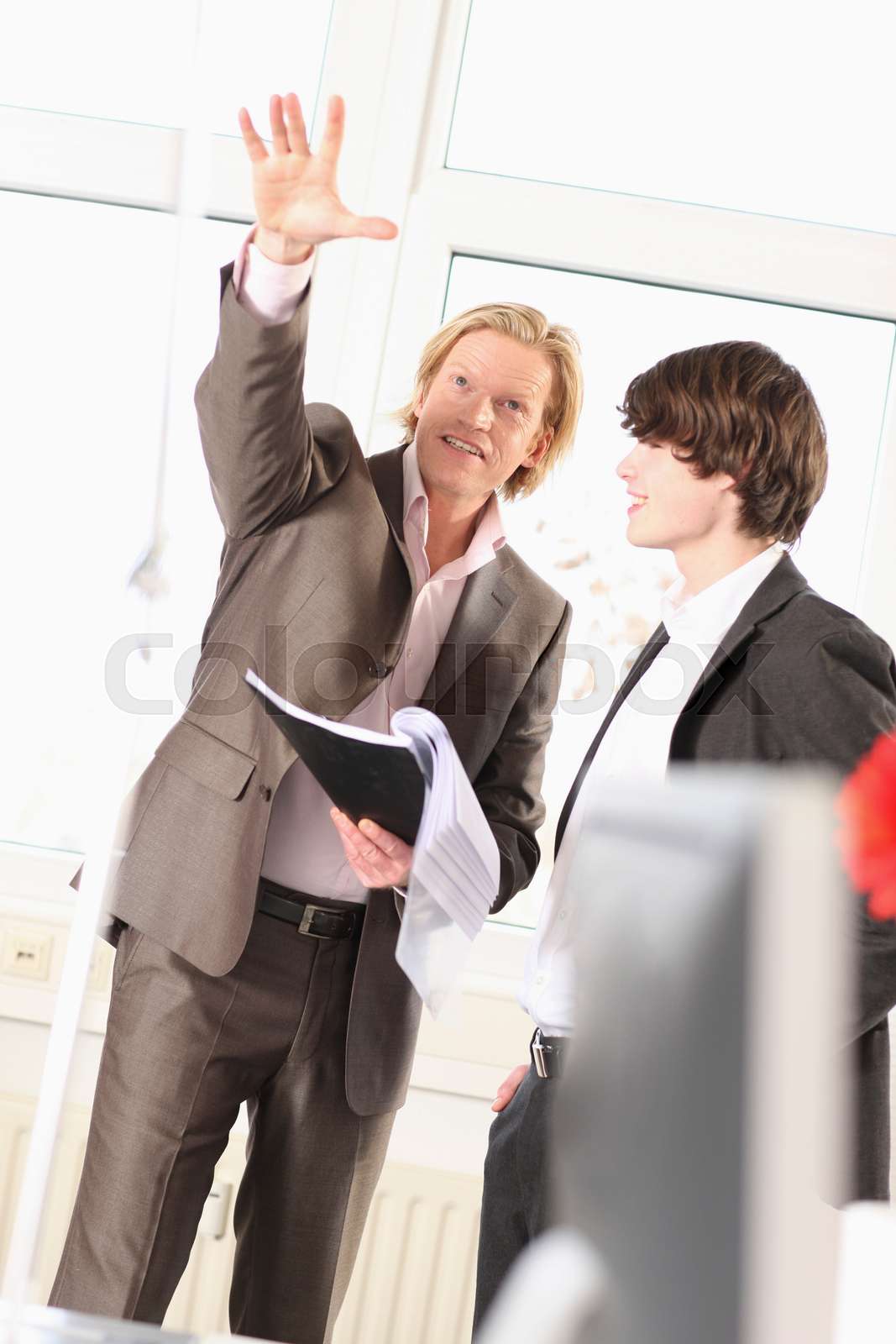 man is teaching something to a trainee | Stock image | Colourbox