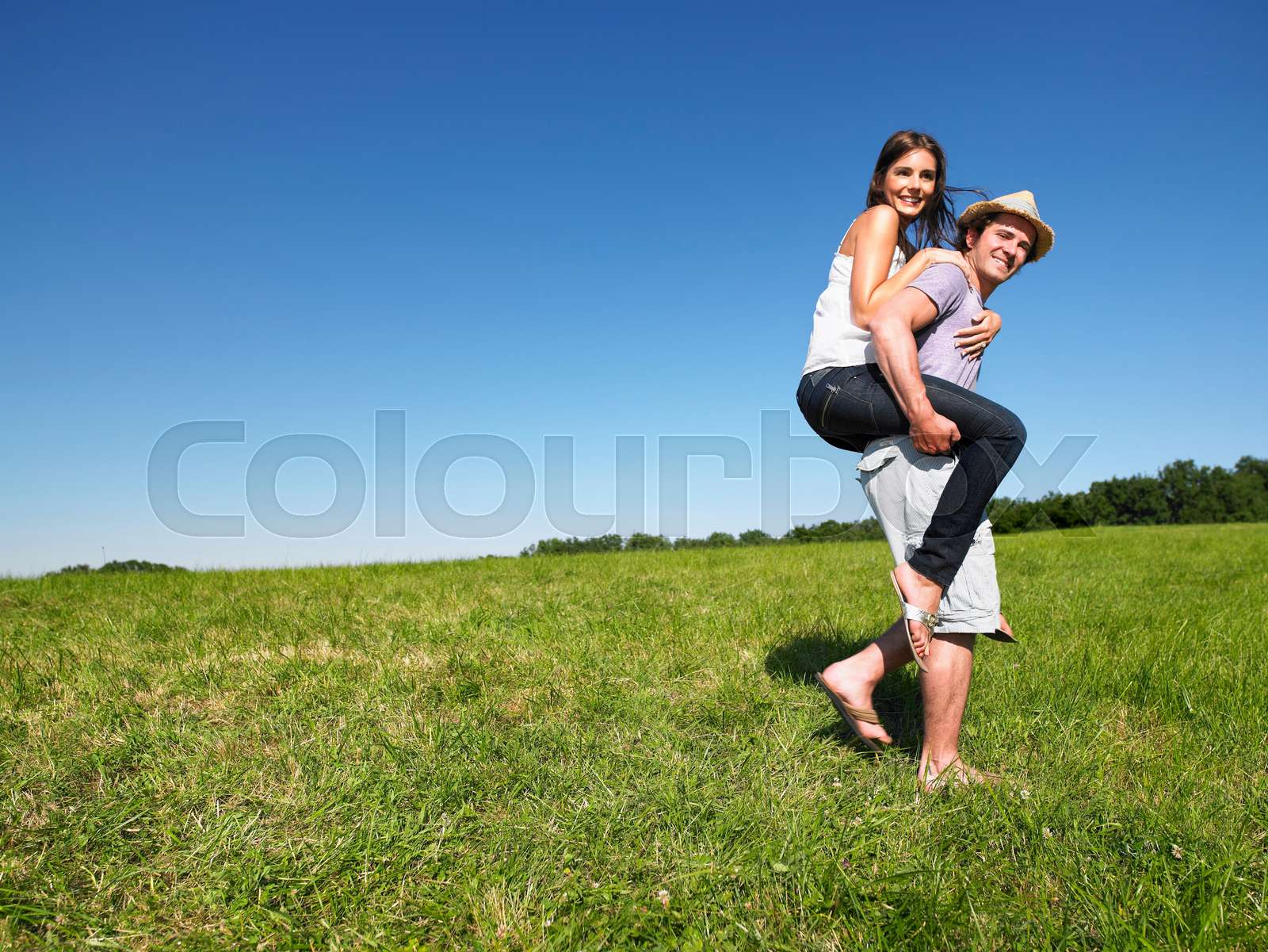 young people riding piggy back | Stock image | Colourbox