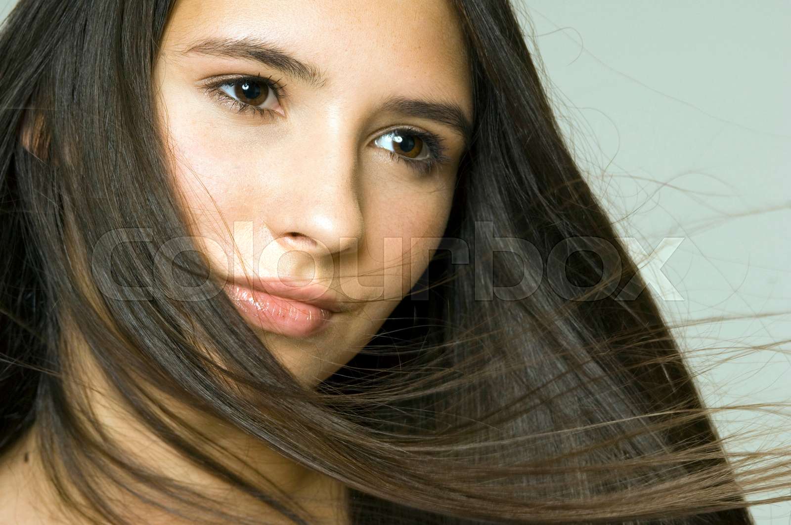 hair blowing across girls face | Stock image | Colourbox