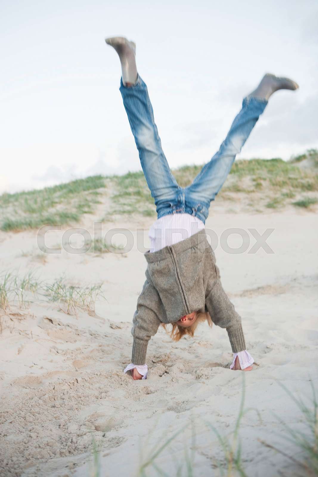 Girl playing on beach | Stock image | Colourbox