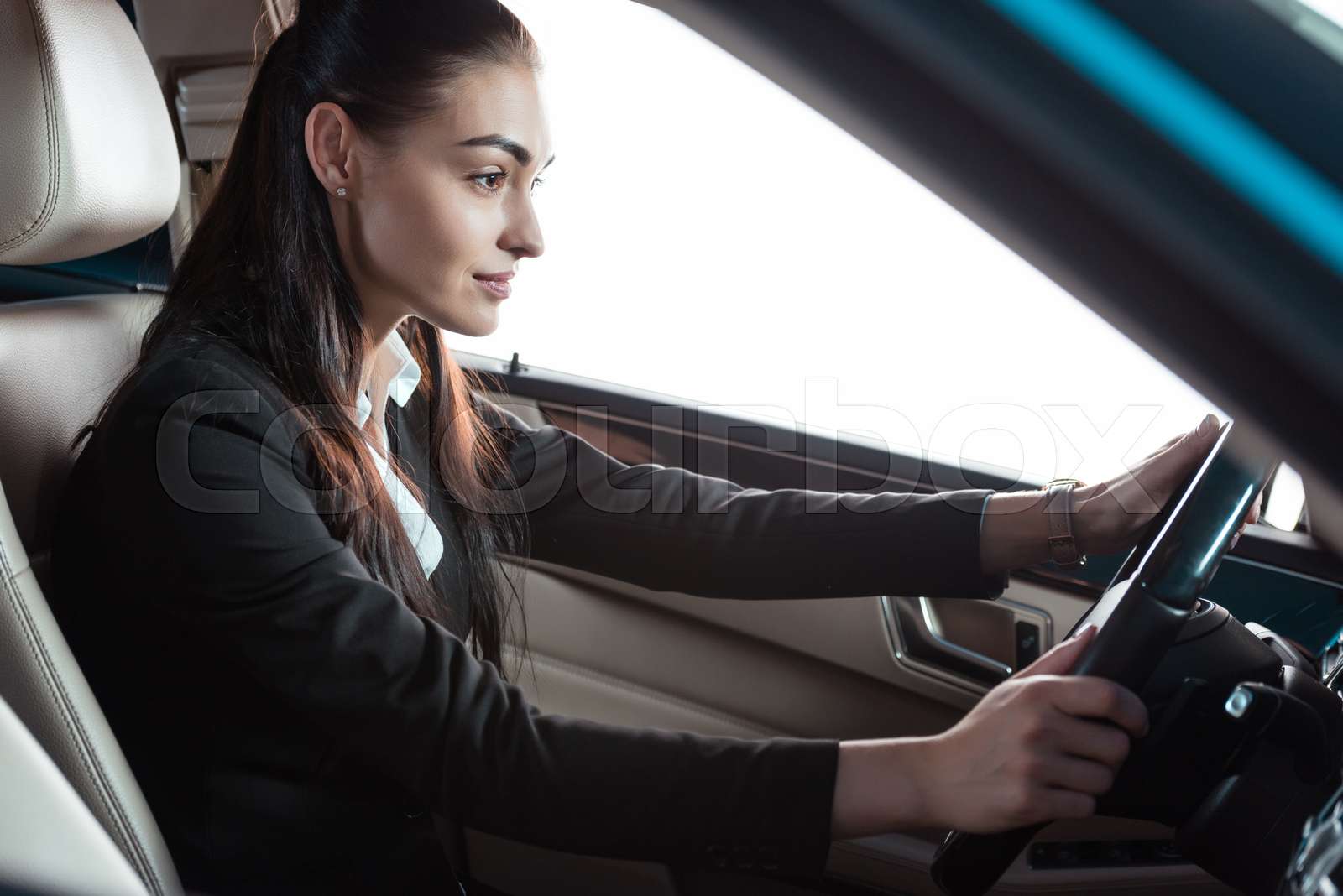 businesswoman driving car | Stock image | Colourbox