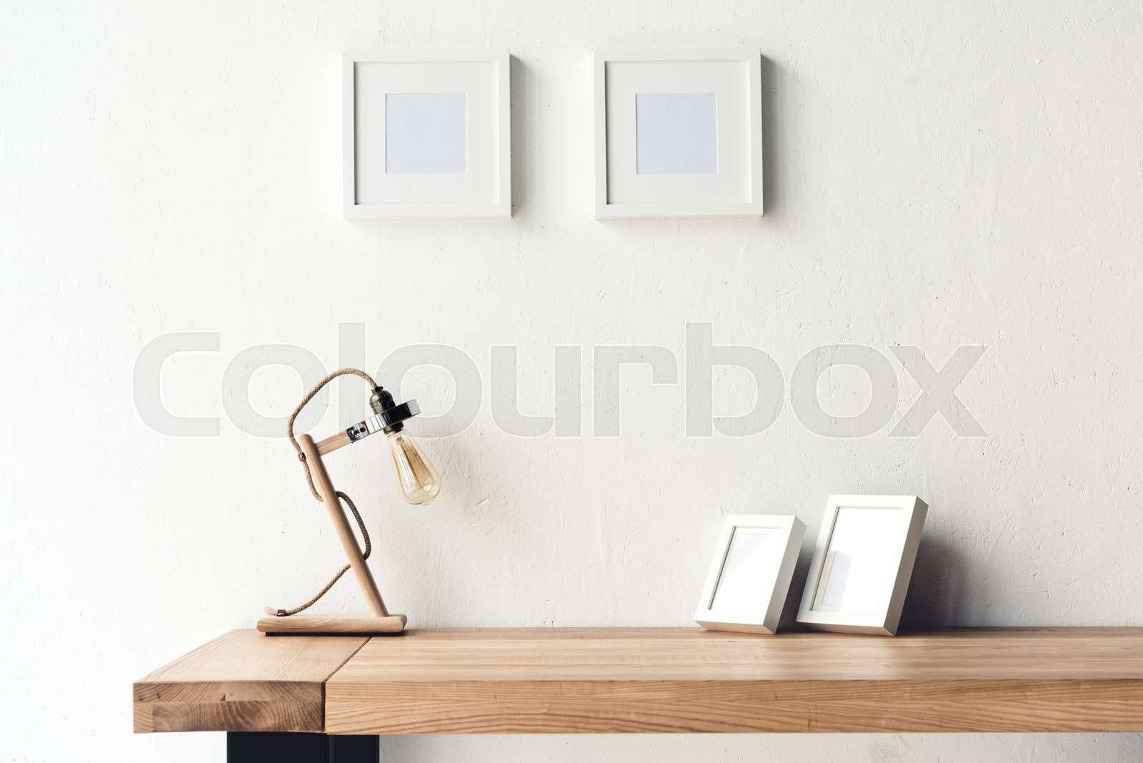 photo frames hanging on wall at workplace | Stock image | Colourbox
