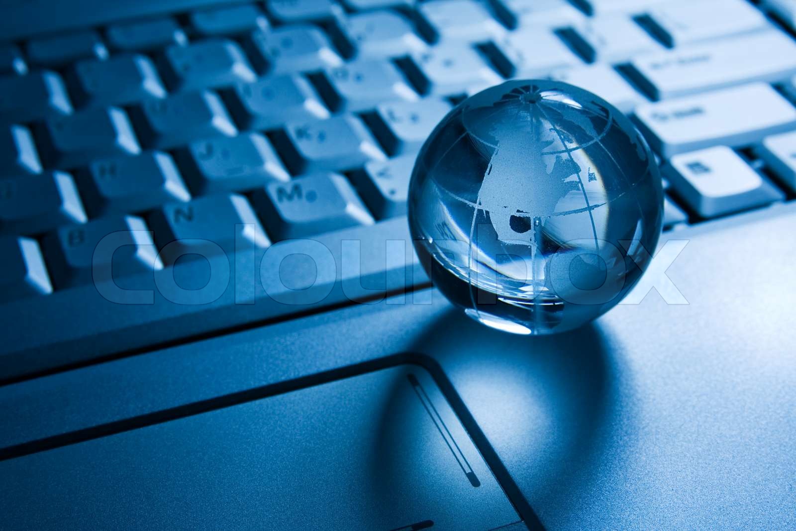 globalization concept. transparent globe on a laptop keyboard | Stock ...