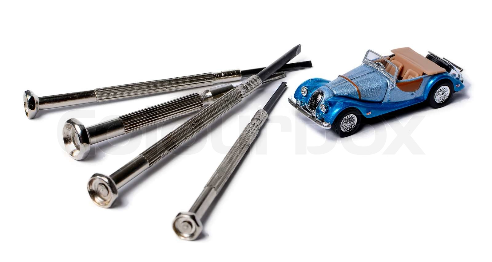 miniature car and a screwdrivers isolated on white | Stock image ...