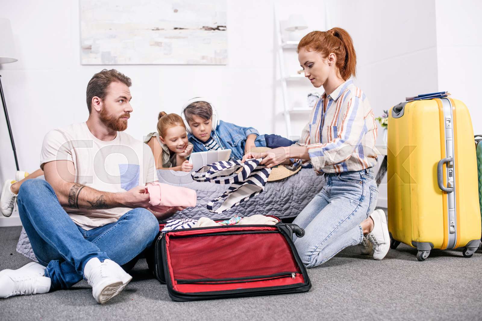 family packing luggage for trip | Stock image | Colourbox