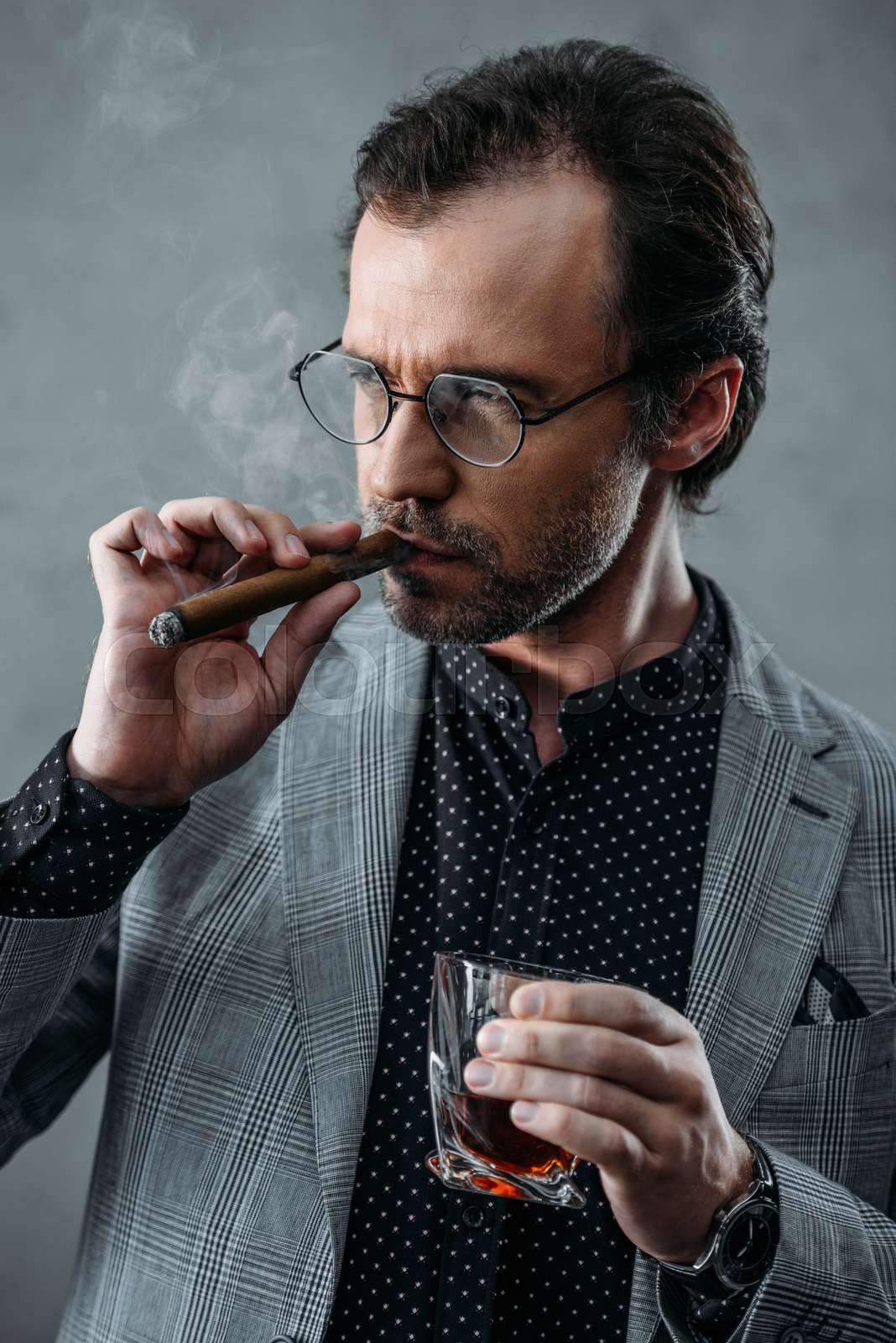 businessman smoking cigar | Stock image | Colourbox