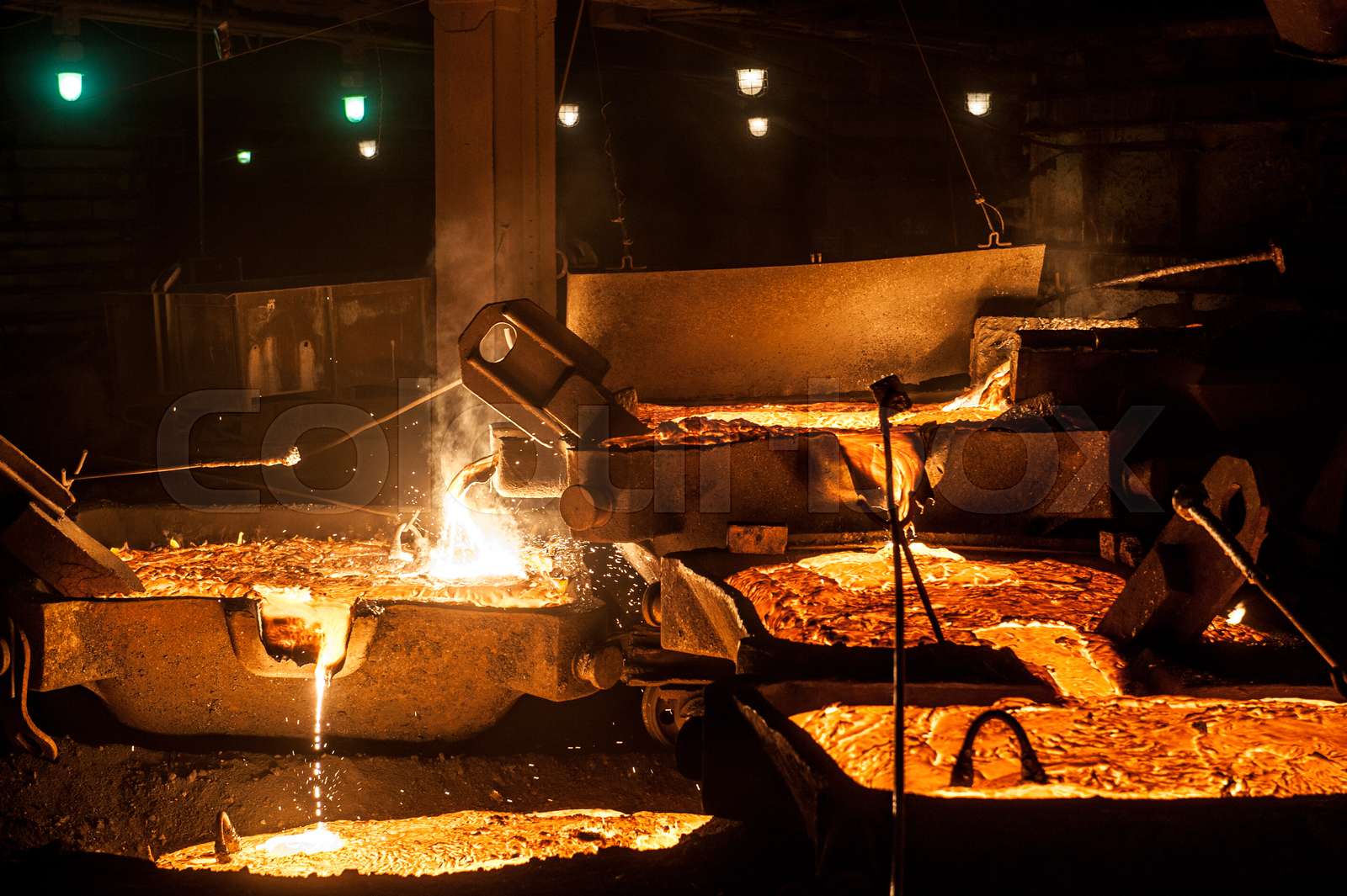 Pouring liquid titanium slag from arc furnace | Stock image | Colourbox