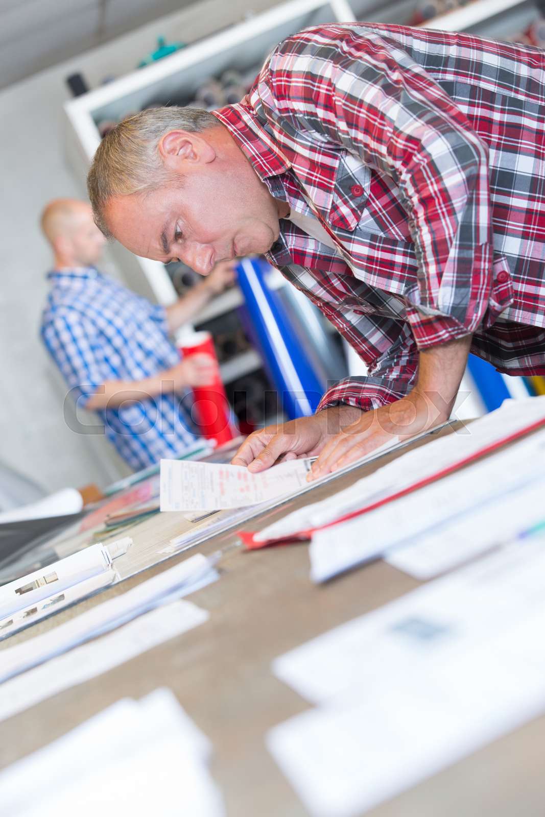 checking the papers | Stock image | Colourbox