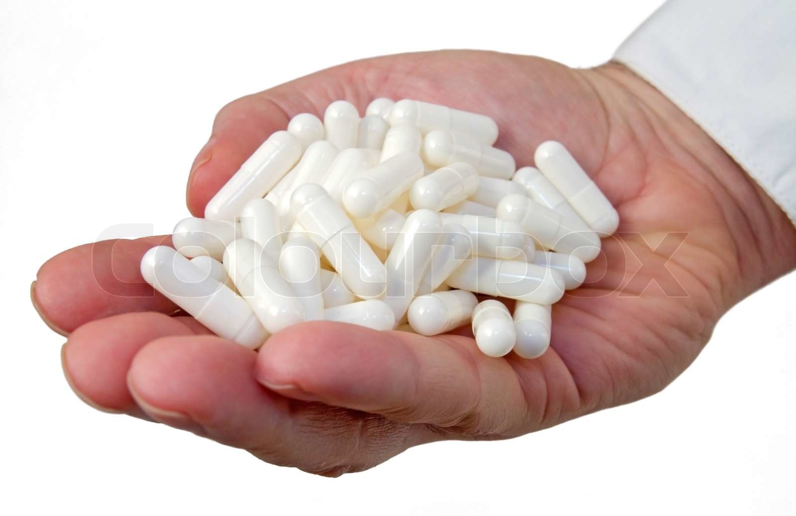capsule in open hand | Stock image | Colourbox