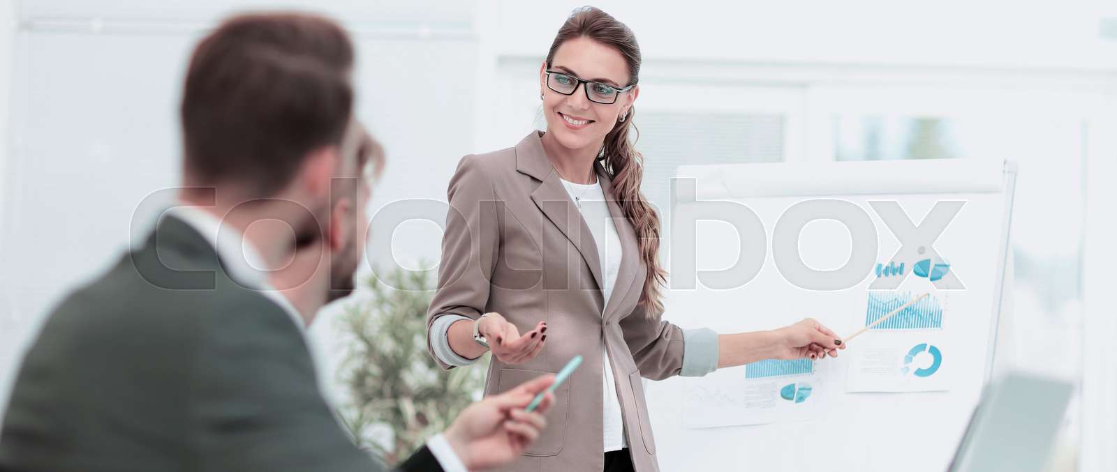 Successful Woman making a business presentation to a group | Stock ...