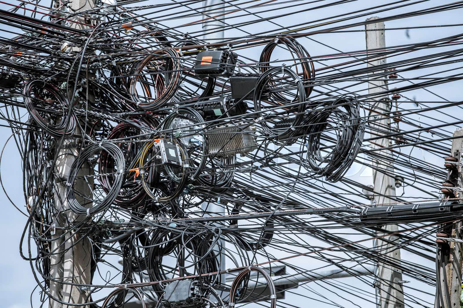 messy electrical cables on post | Stock image | Colourbox