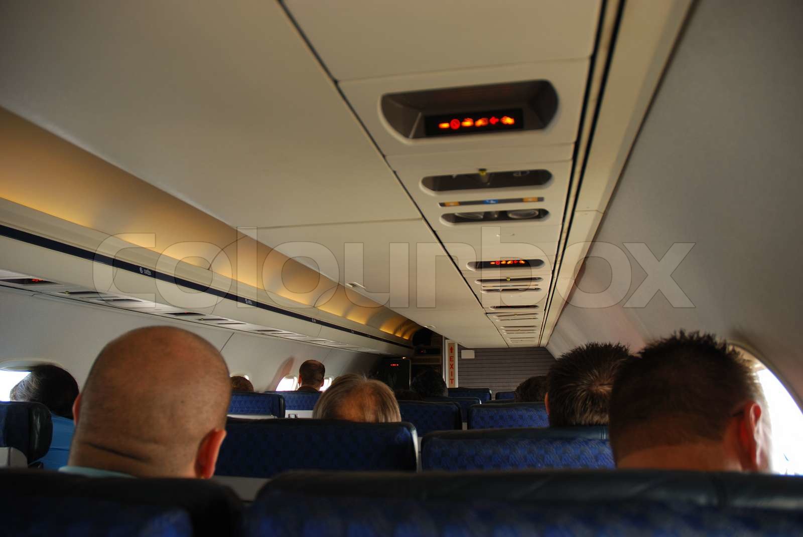 Passengers inside of an airplane | Stock image | Colourbox