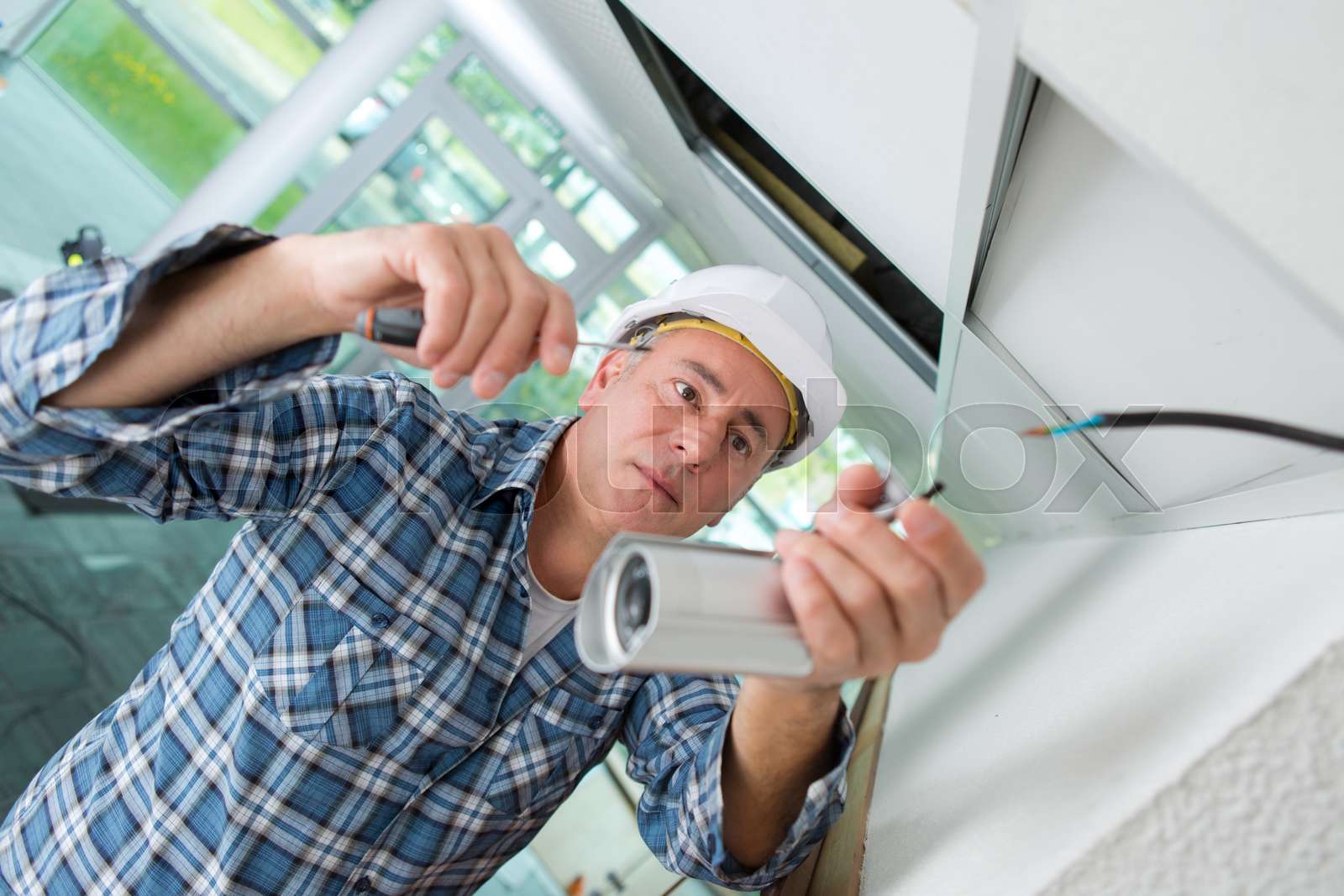 professional cctv technician working | Stock image | Colourbox