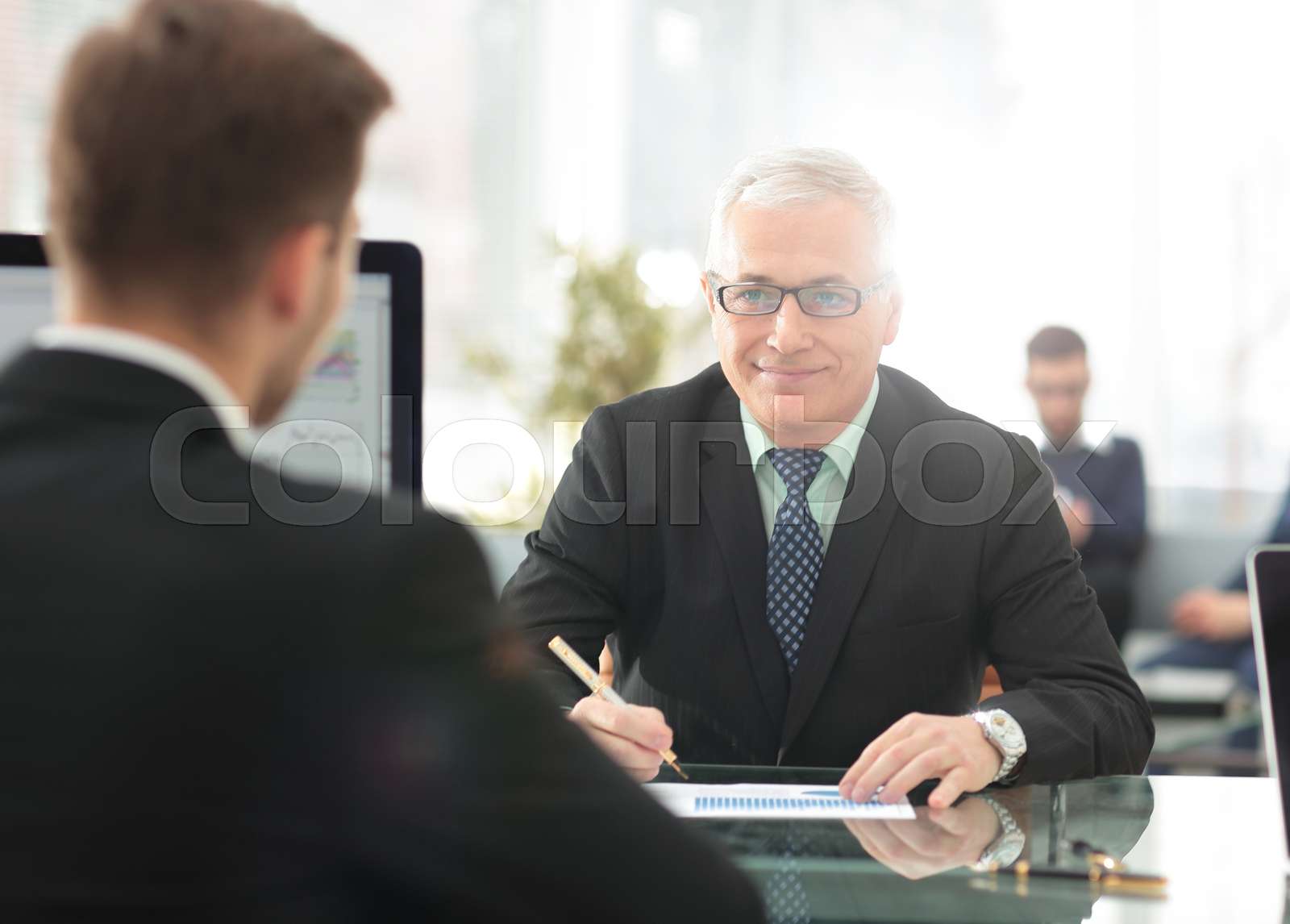 project Manager conducts an interview with a new employee | Stock image ...