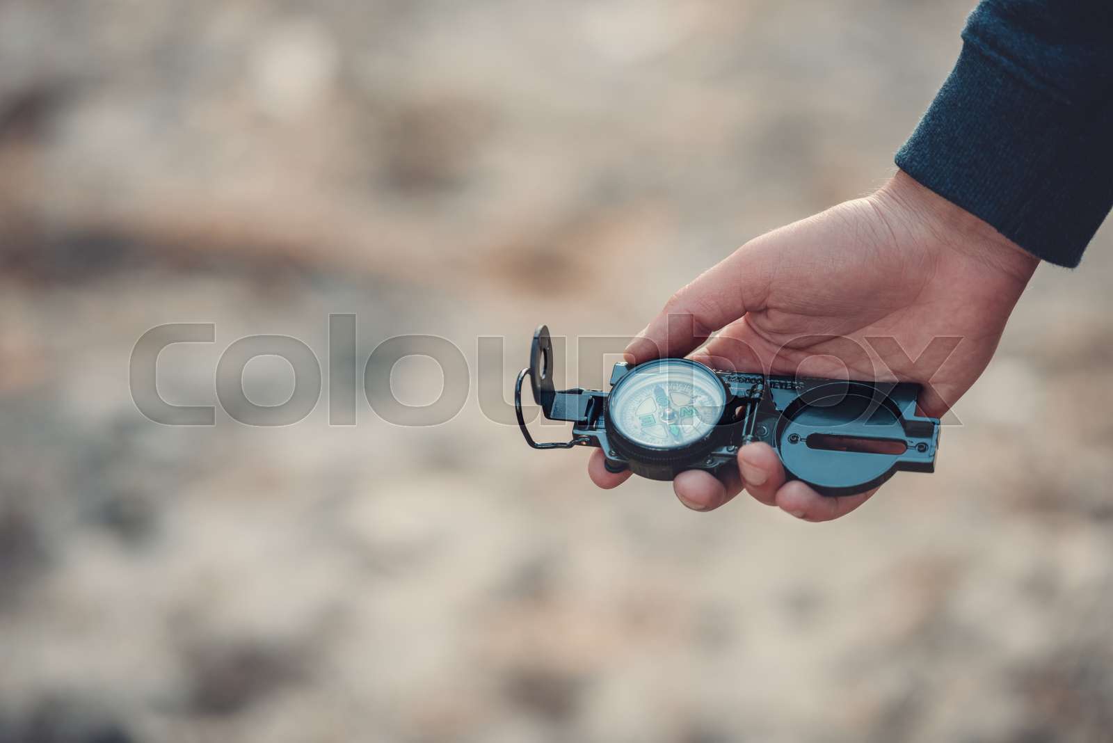 man holding compass | Stock image | Colourbox
