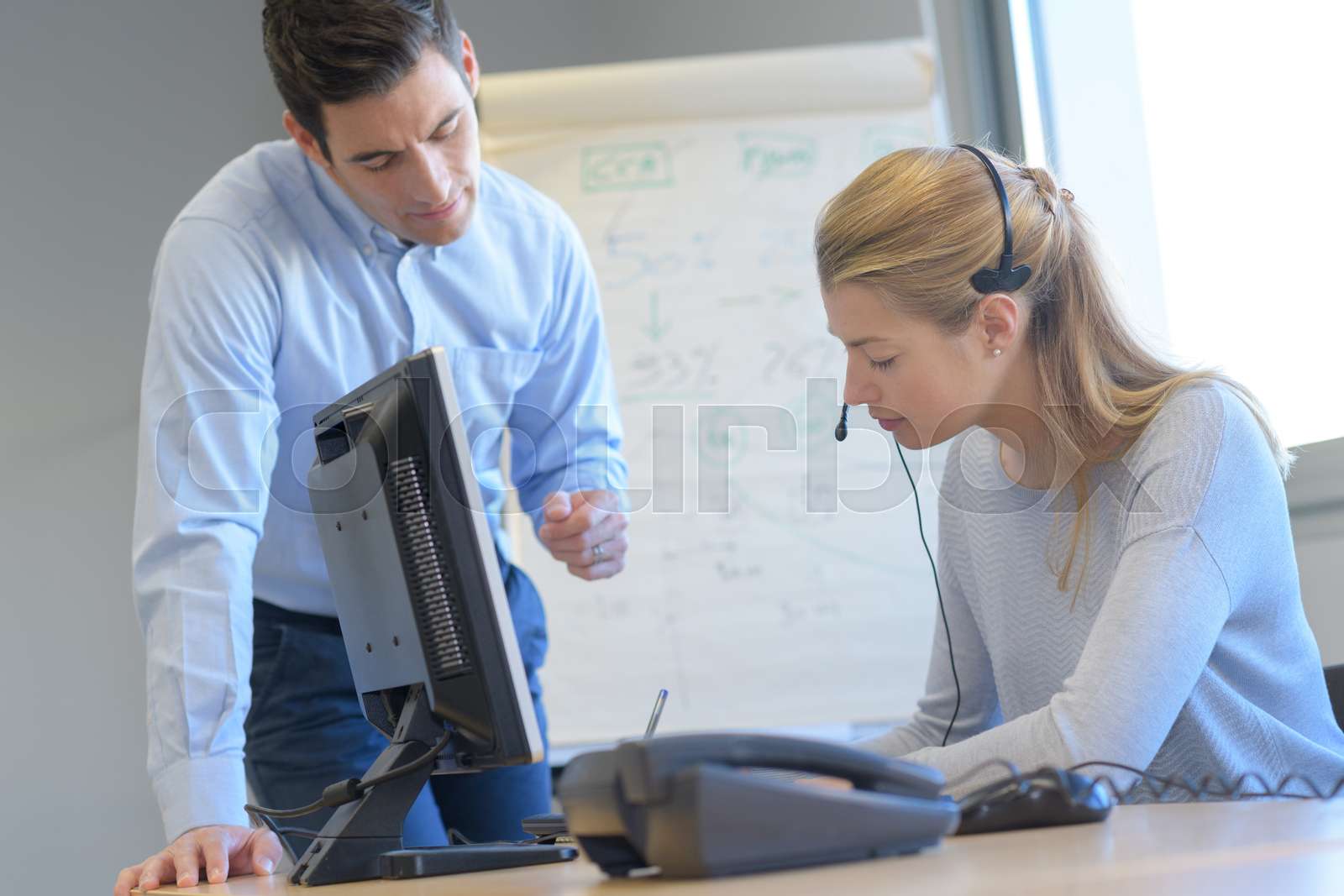 beautiful female employee with her boss in the office | Stock image ...