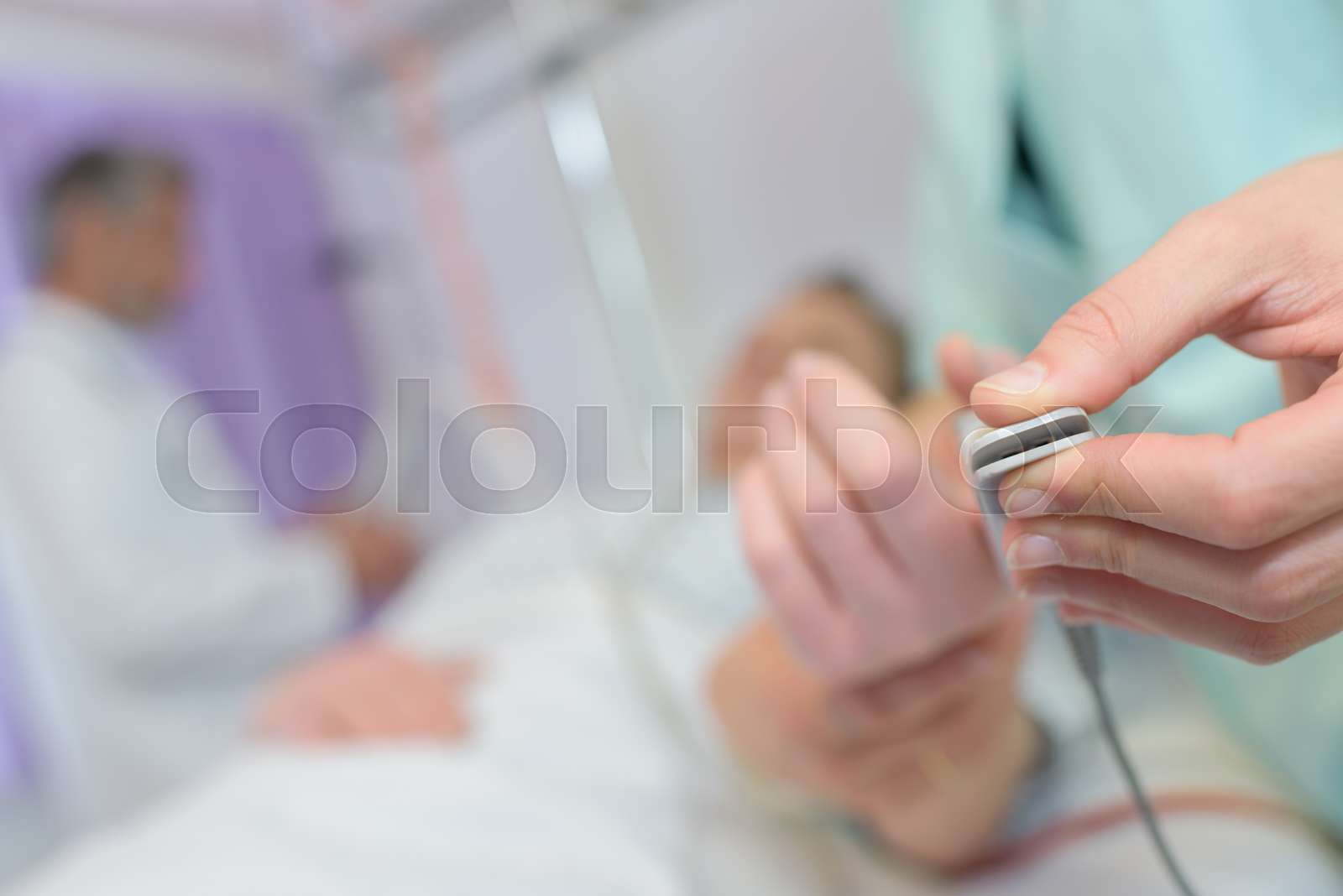 medical device kit attached to the finger of a patient | Stock image ...