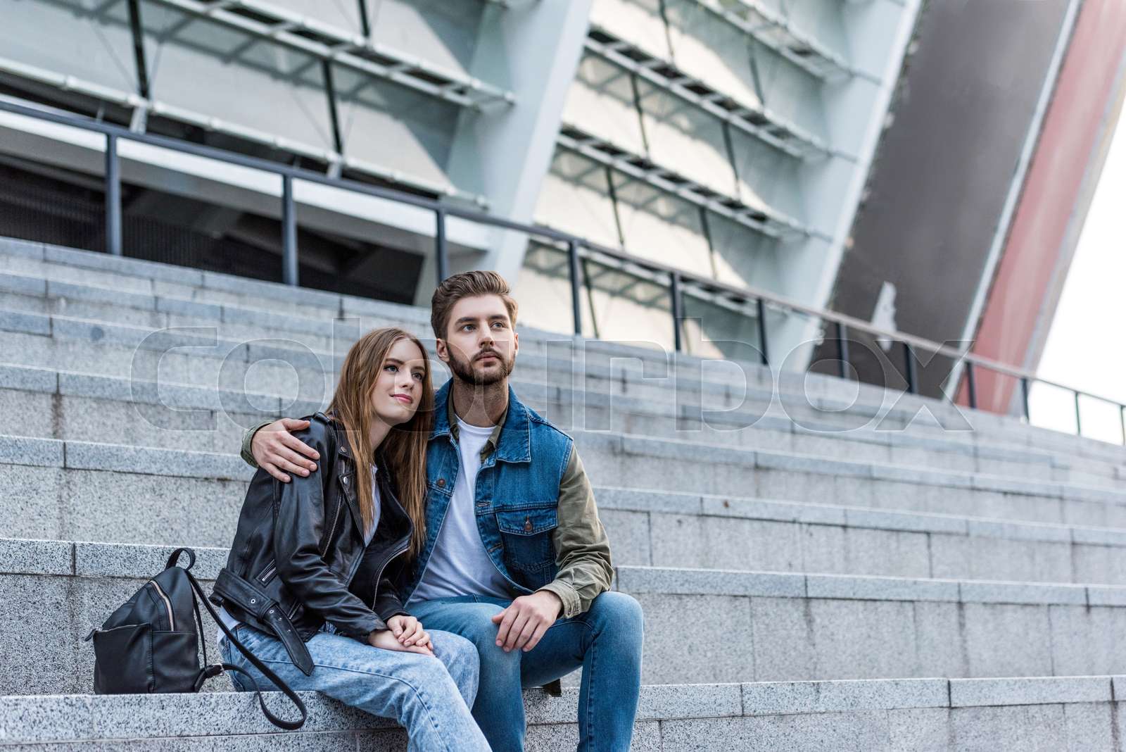 couple sitting on stairs on street | Stock image | Colourbox