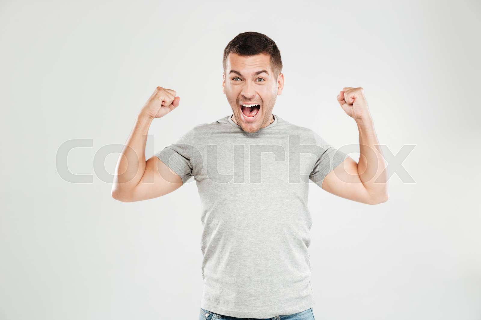Happy screaming man showing biceps. Looking camera. | Stock image ...