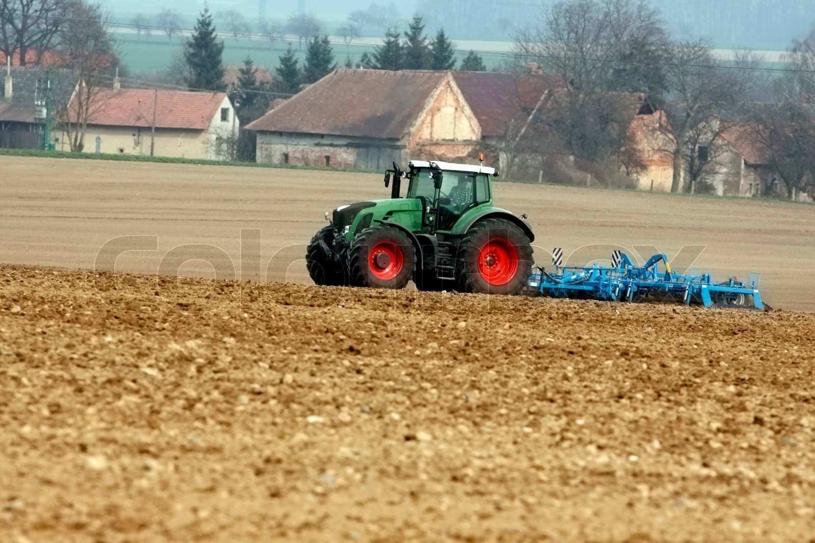 tractor at work on a field | Stock image | Colourbox