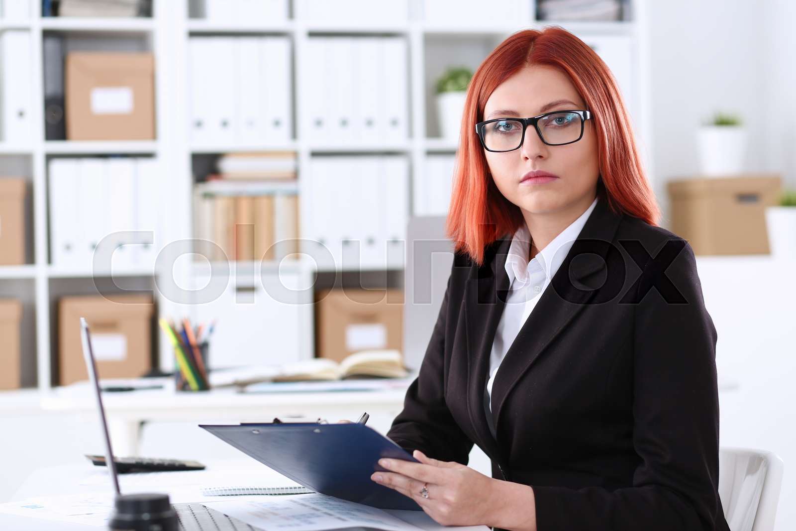 Businesswoman in the workplace in the office | Stock image | Colourbox