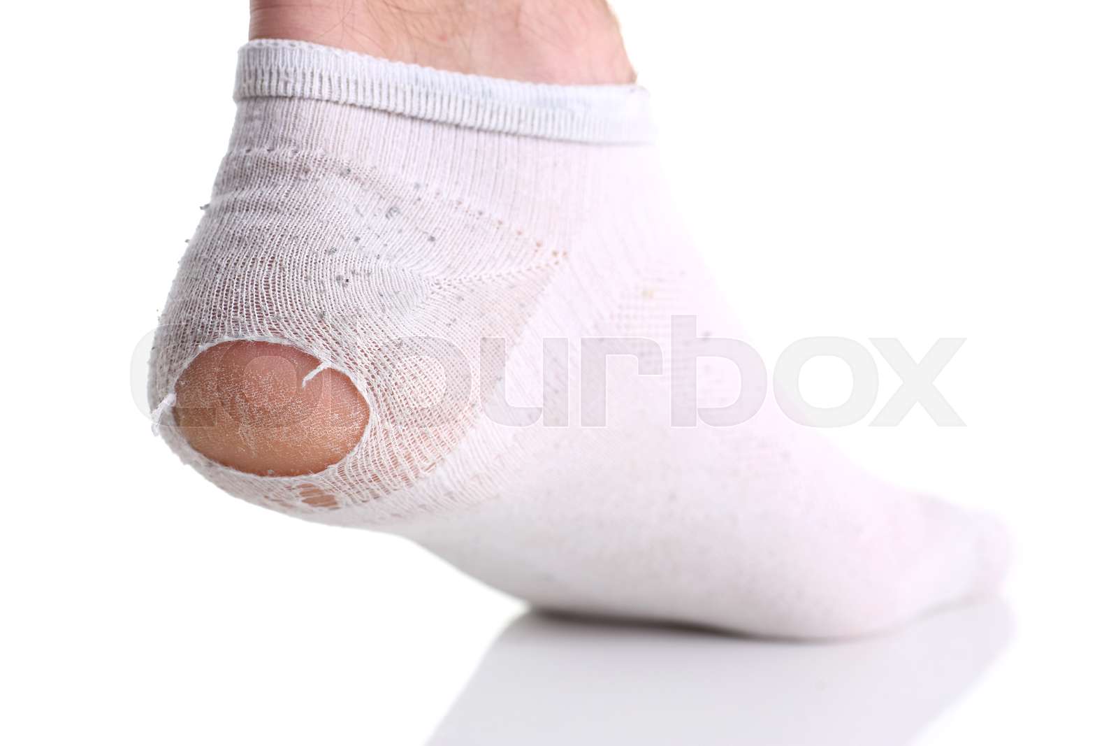 Ripped white sock on male leg isolated | Stock image | Colourbox