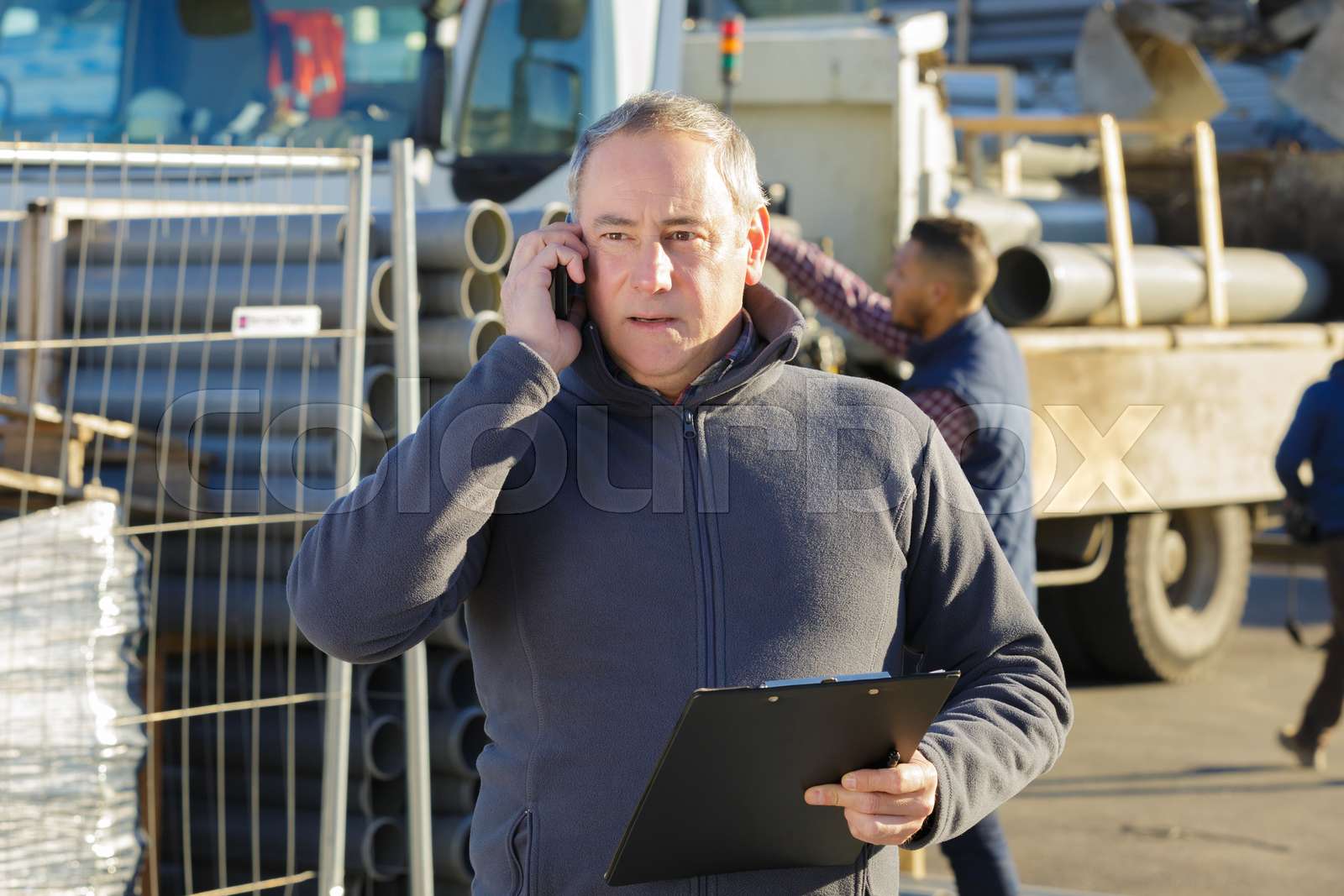 male manager making a phone call outdoors | Stock image | Colourbox