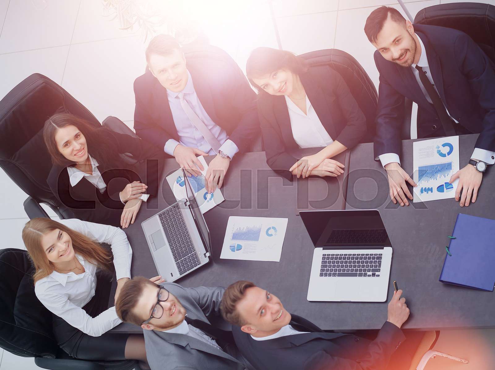 meeting around a table in an office | Stock image | Colourbox