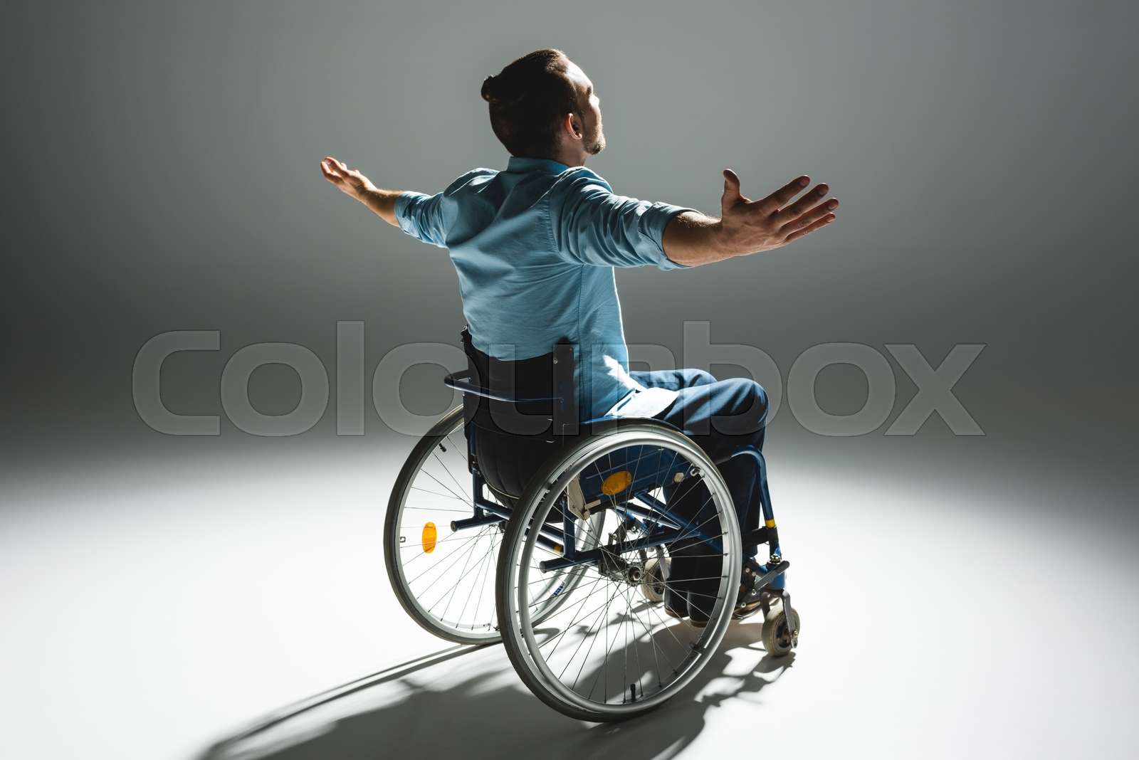 Disabled man posing with arms outstreched | Stock image | Colourbox