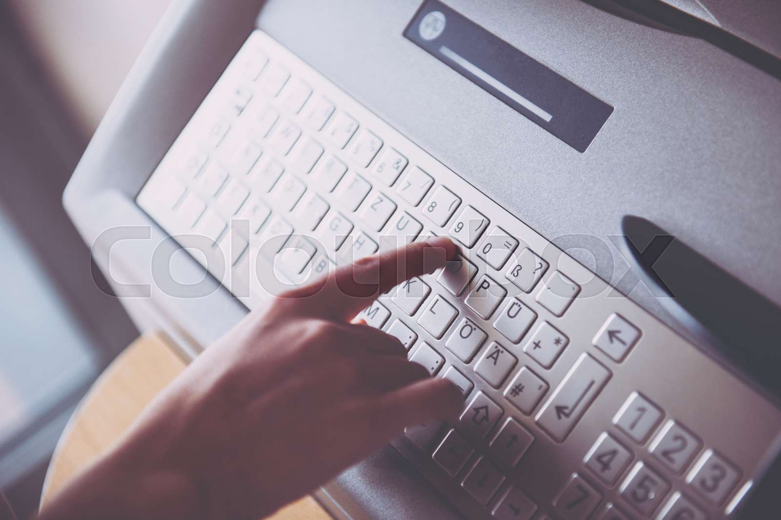 Using modern ATM keyboard | Stock image | Colourbox